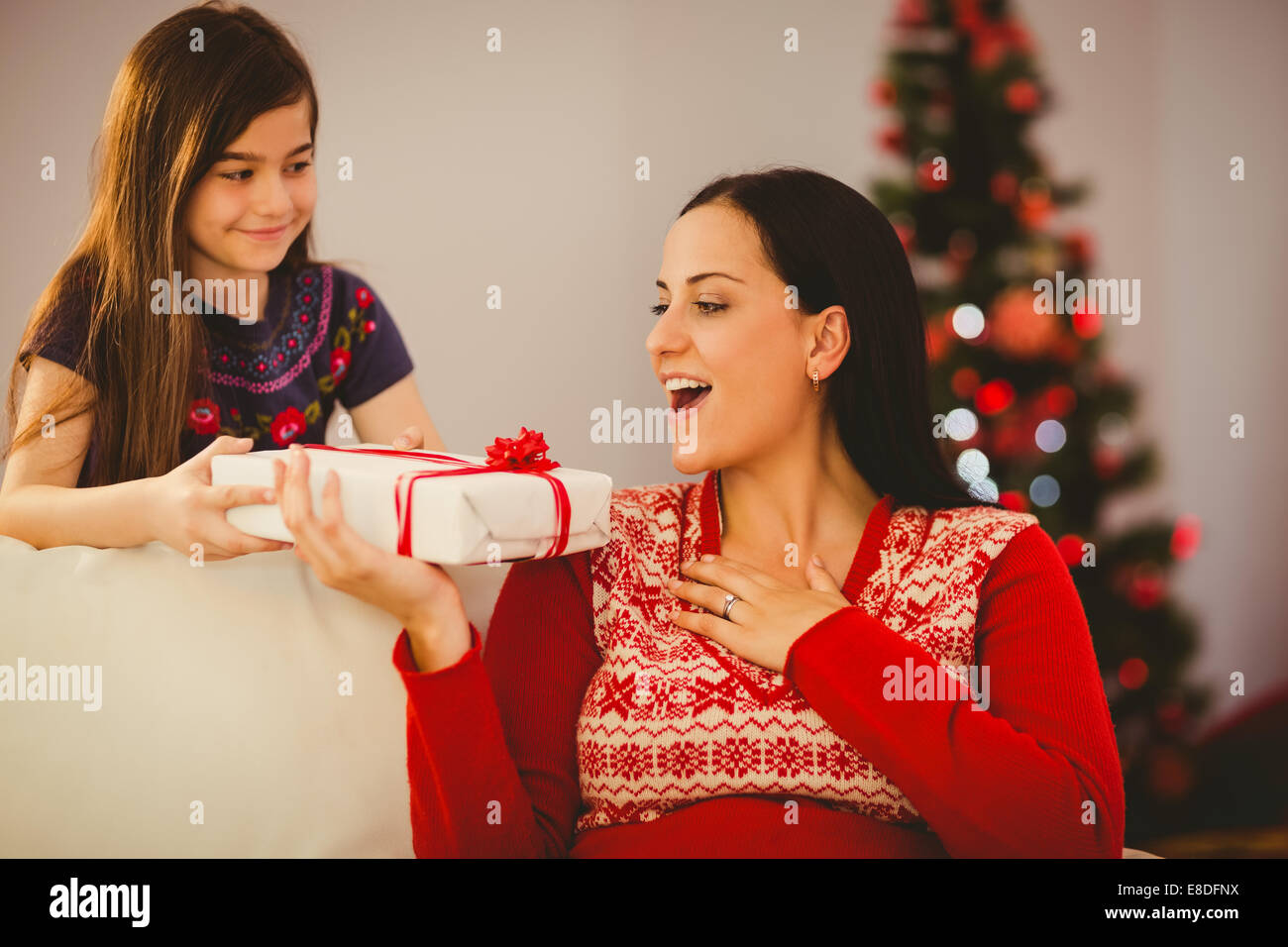 Child giving present hi-res stock photography and images - Alamy
