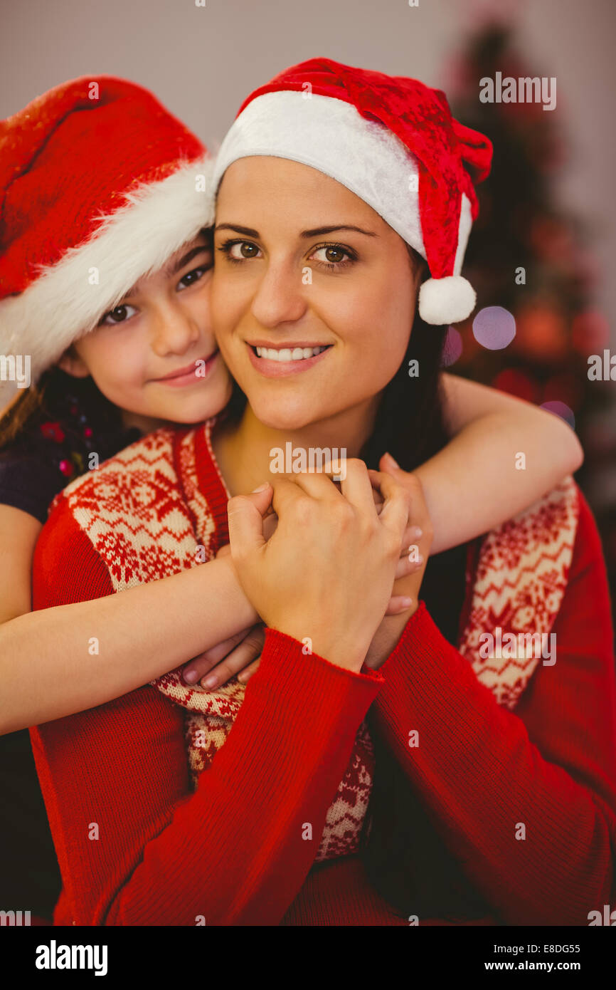 Festive mother and daughter smiling at camera Stock Photo - Alamy Festive mother and daughter smiling at camera Stock Photo - Alamy