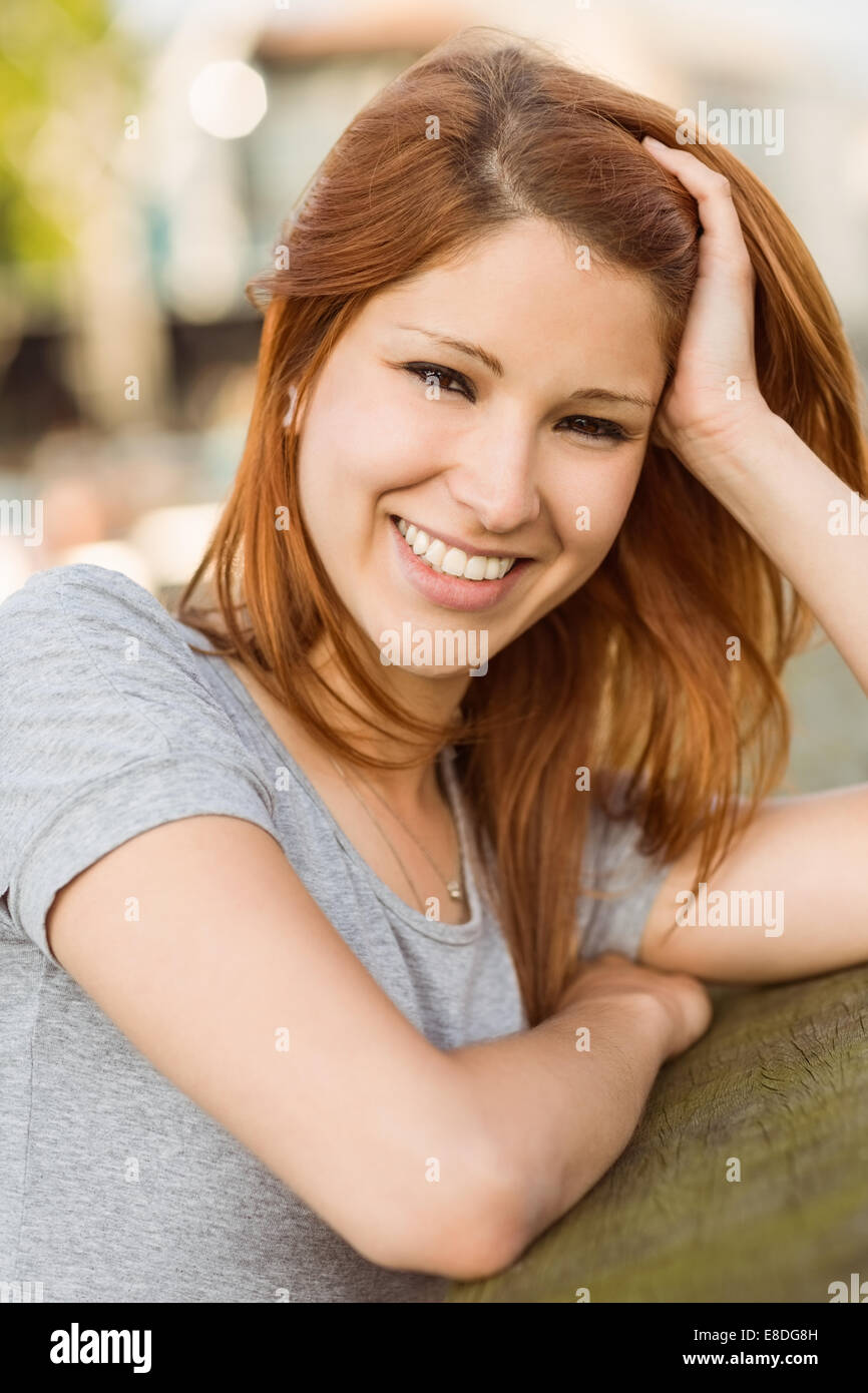 Pretty redhead smiling at camera Stock Photo - Alamy
