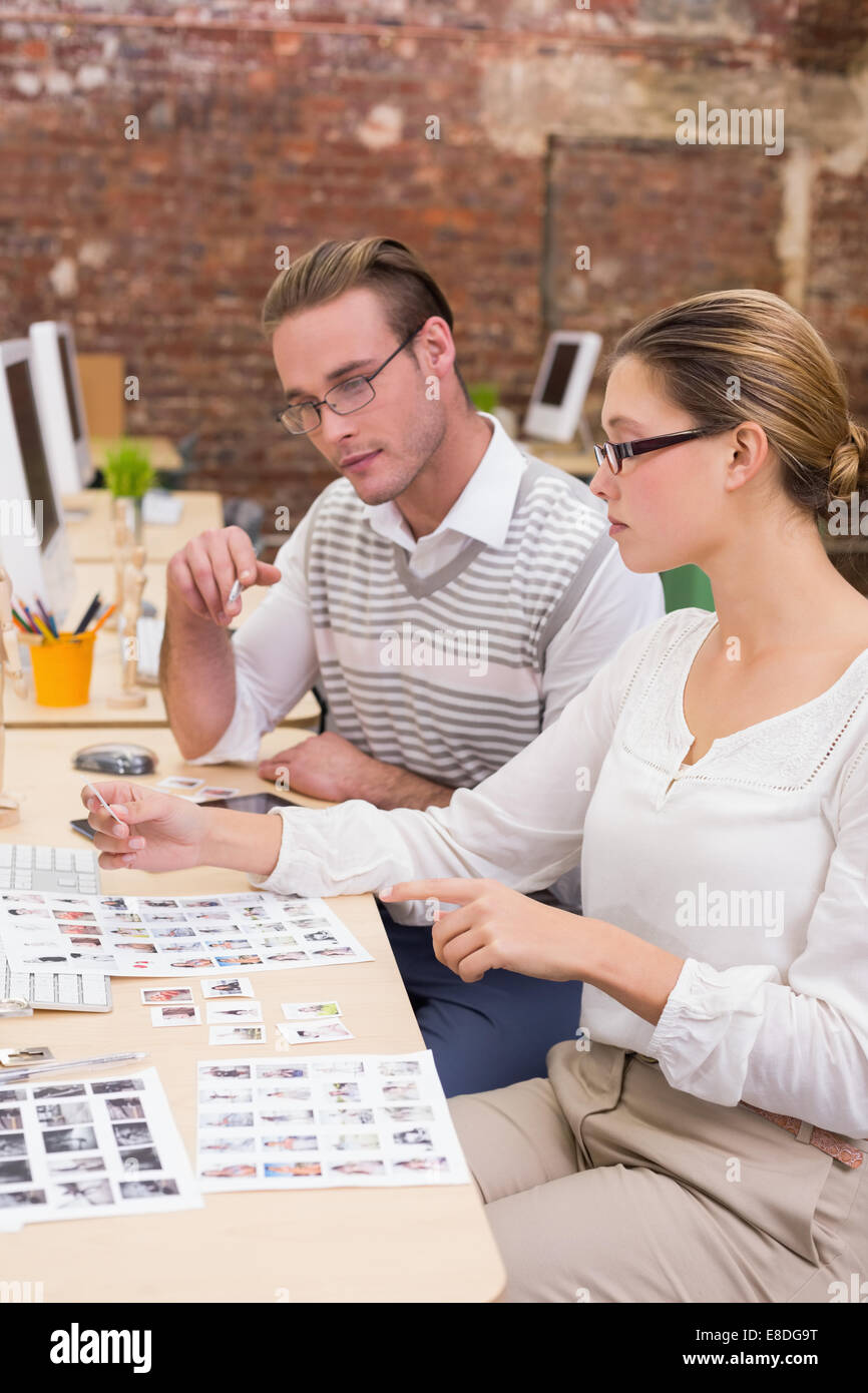 Concentrated photo editors at work in office Stock Photo - Alamy