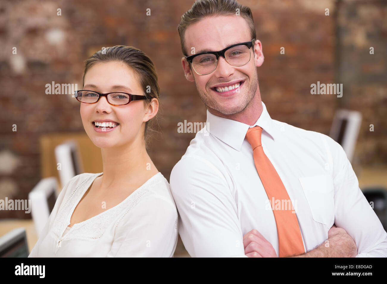 Two smiling business colleagues in office Stock Photo - Alamy