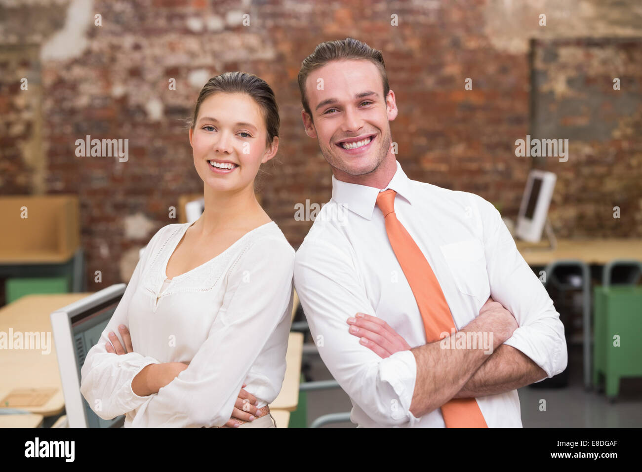 Two smiling business colleagues in office Stock Photo - Alamy