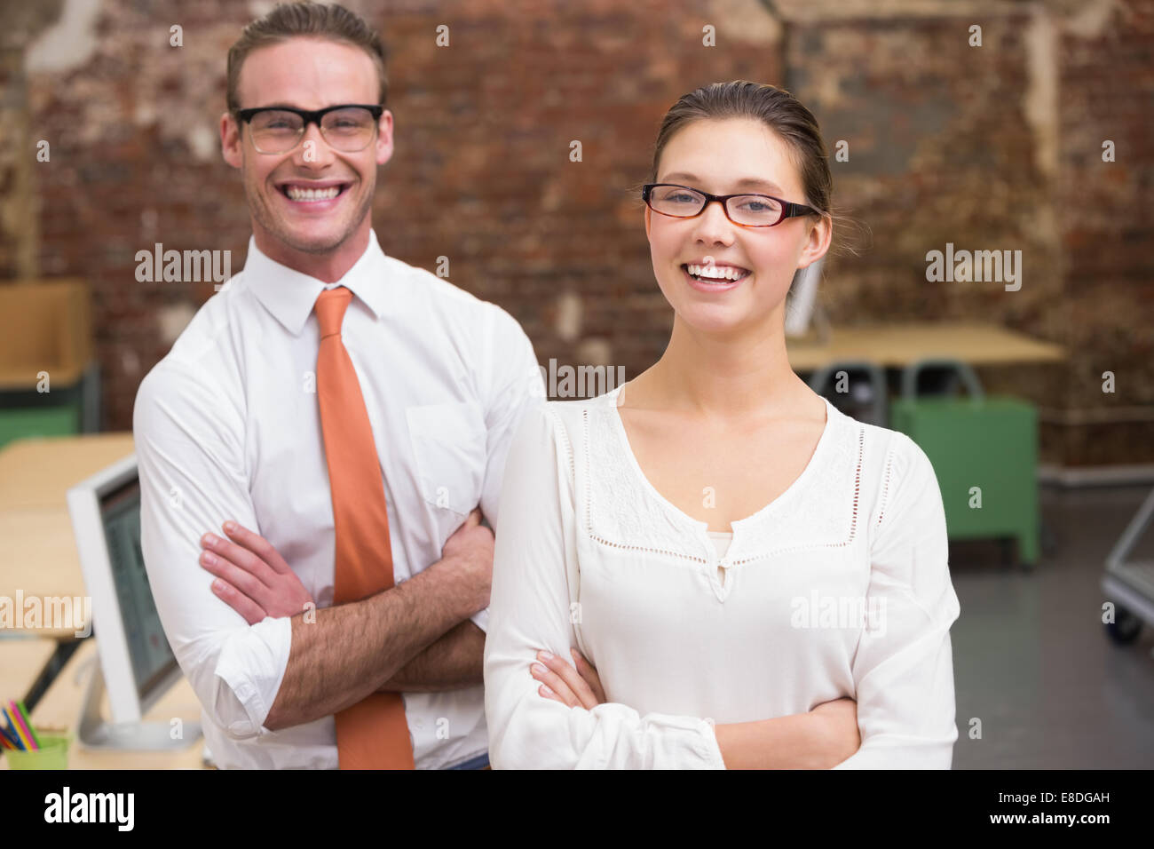 Two smiling business colleagues in office Stock Photo - Alamy