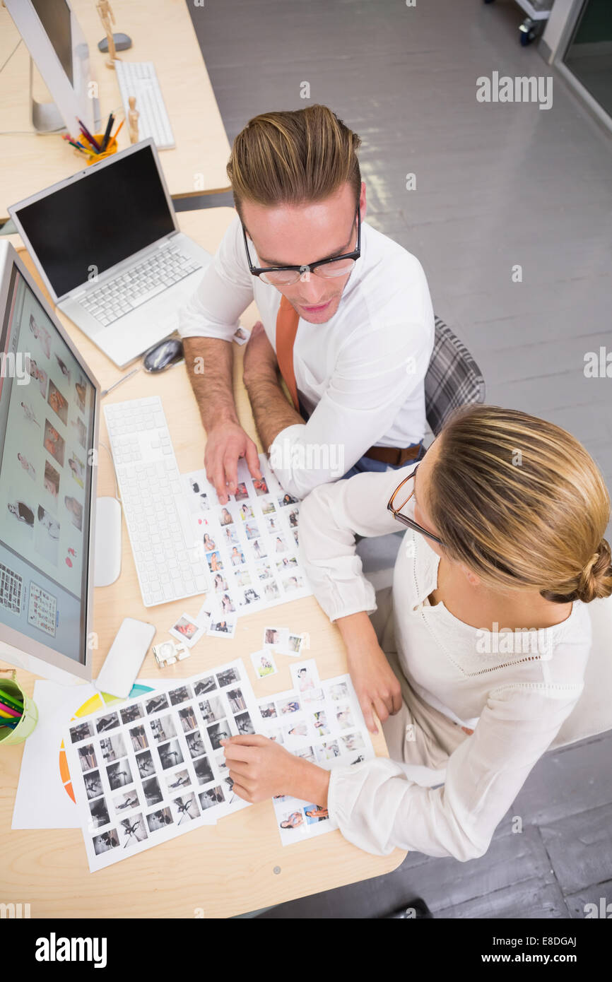 Concentrated casual photo editors at work in office Stock Photo - Alamy