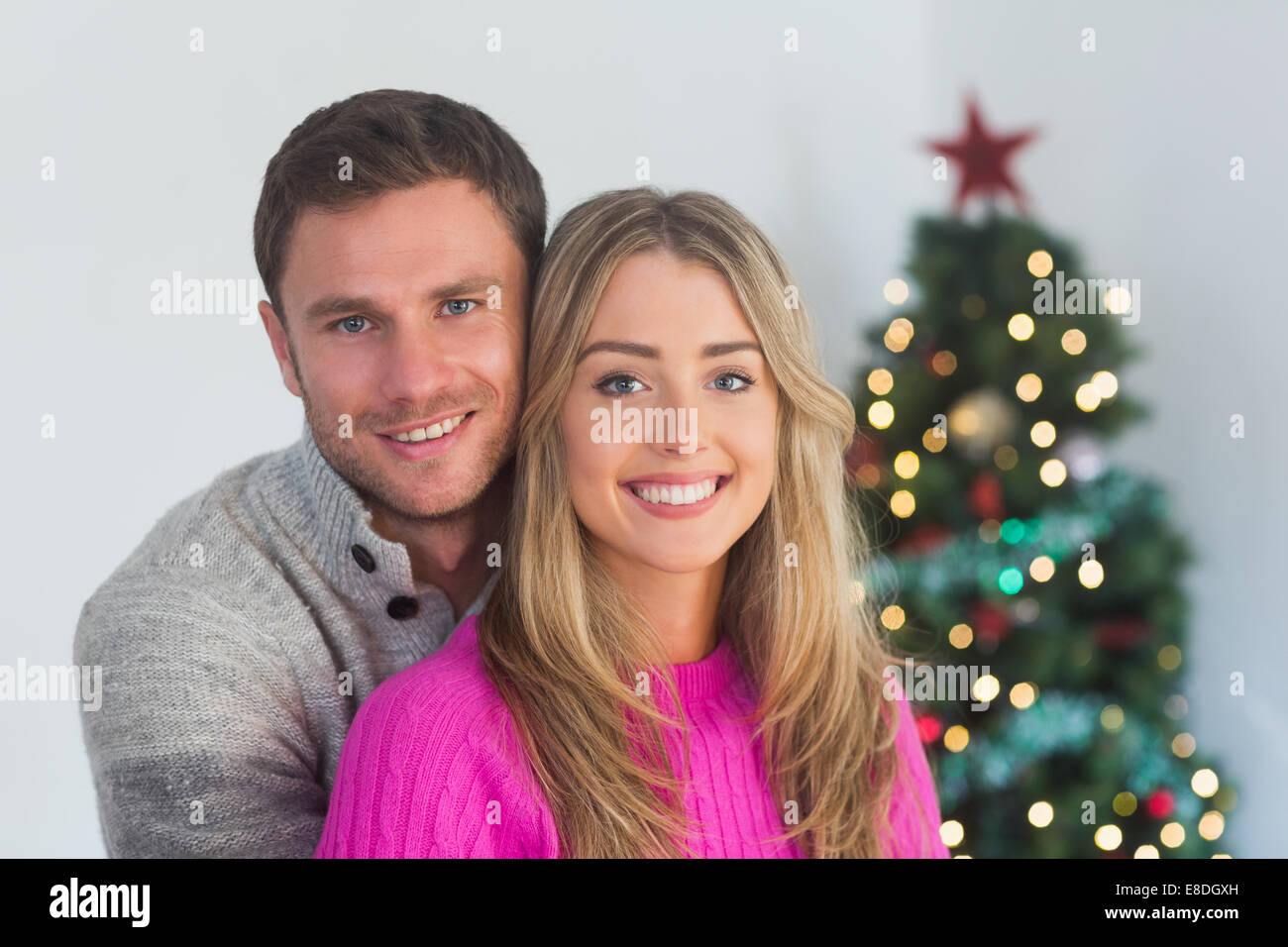 Happy couple holding each other Stock Photo - Alamy