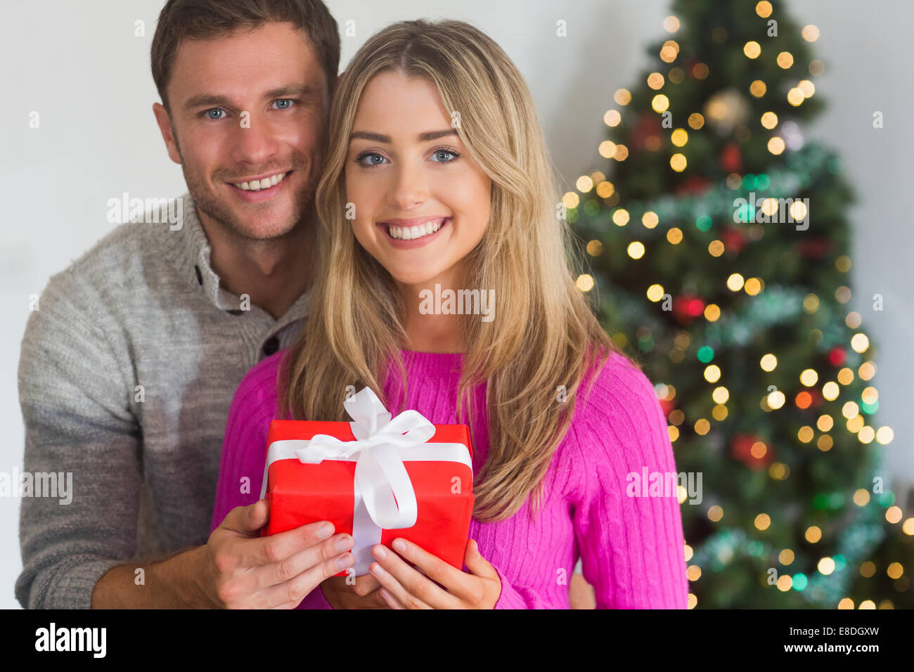 Happy couple holding each other Stock Photo - Alamy