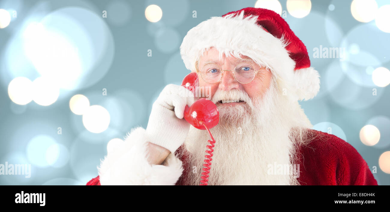 Composite image of santa claus on the phone Stock Photo - Alamy