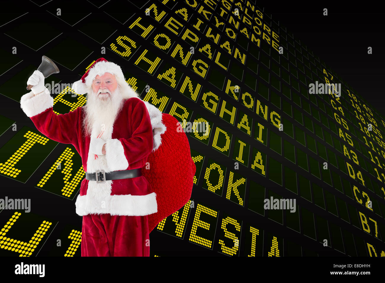 Composite image of santa claus ringing bell Stock Photo - Alamy