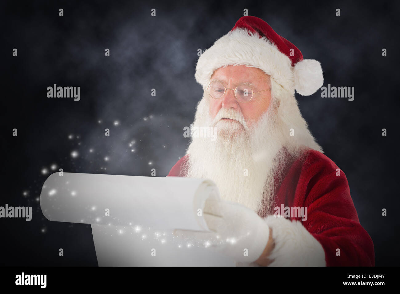 Composite image of santa claus checking his list Stock Photo - Alamy