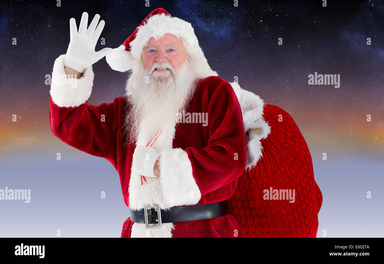 Composite image of santa claus waving Stock Photo - Alamy