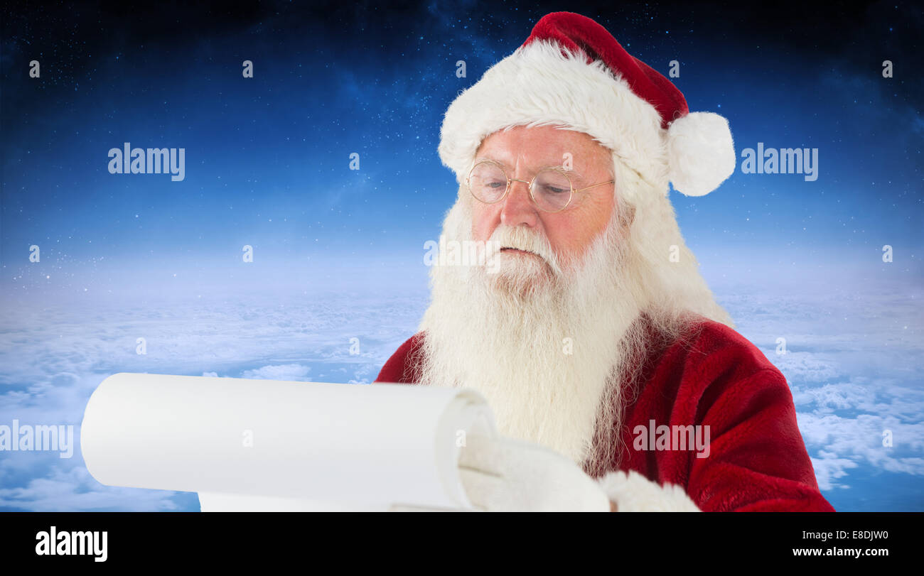 Composite image of santa claus checking his list Stock Photo - Alamy