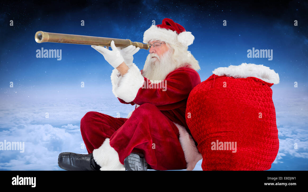 Composite image of santa claus looking through telescope Stock Photo ...
