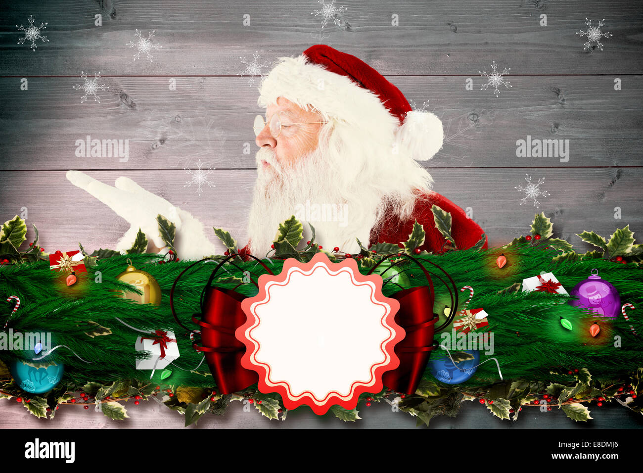 Composite image of santa claus blowing Stock Photo - Alamy
