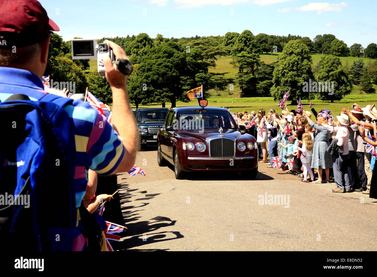The royal car carrying Queen Elizabeth and Prince Philip on a visit to ...