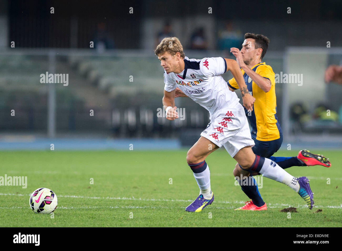Verona, Italy. 4th Oct, 2014. Samuele Longo (Cagliari), Gustavo ...