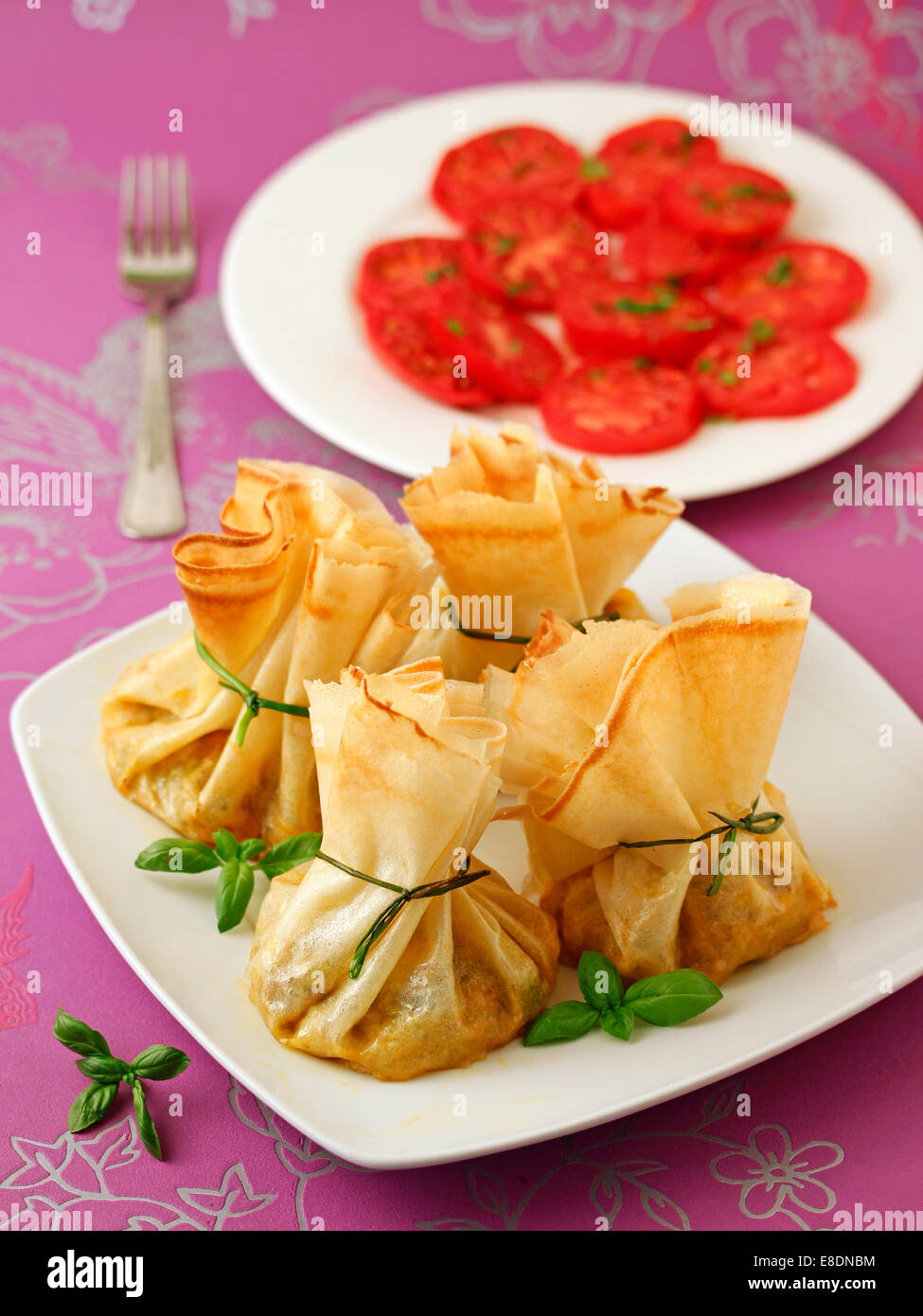 Little bags with vegetables and tofu. Recipe available Stock Photo - Alamy