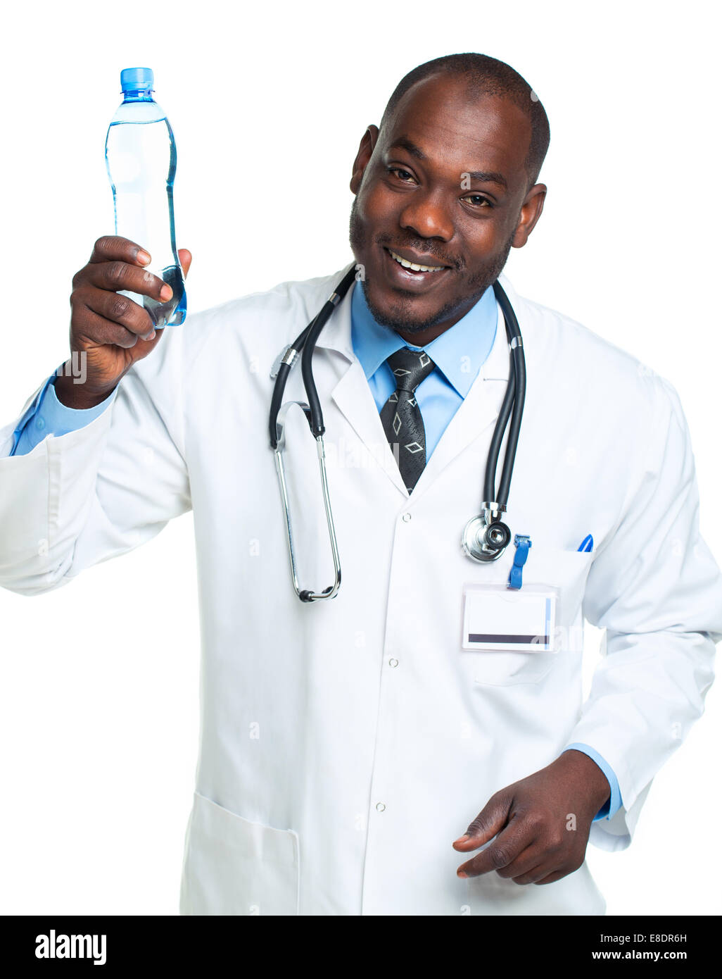 Portrait of a smiling male doctor holding bottle of water on white ...