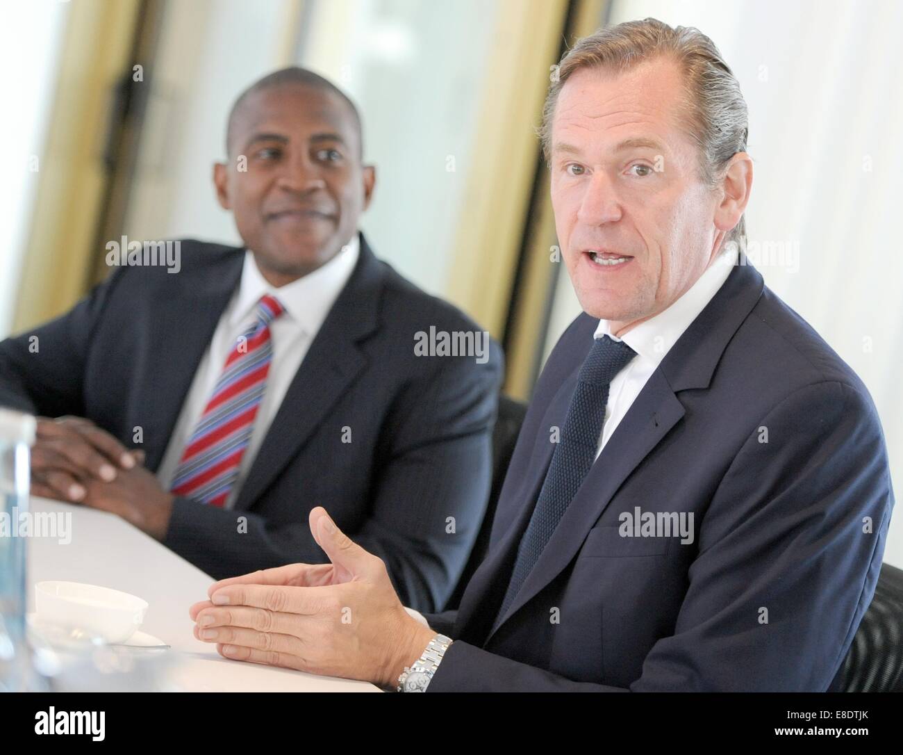 Carlos Watson (L), founder of the US online magazine OZY.com, and ...