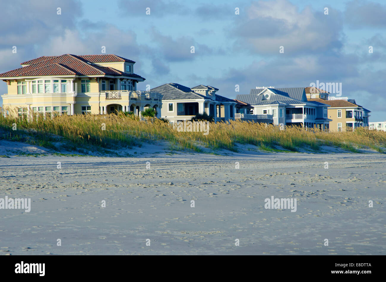 A row of oceanfront, upscale, beach houses. Taken just before sunset ...