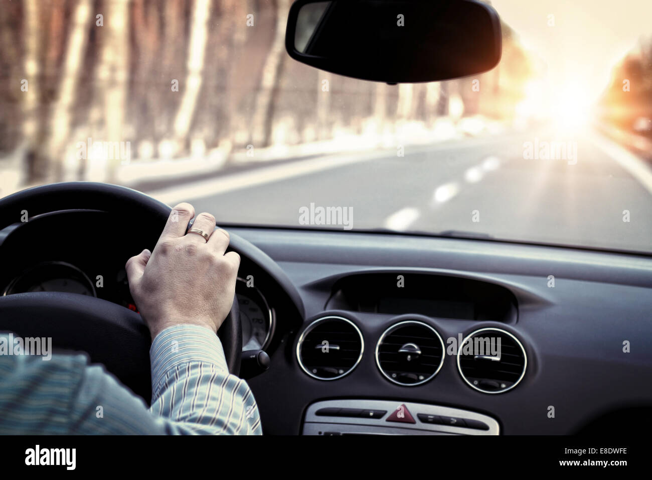 Driving car on empty road Stock Photo - Alamy