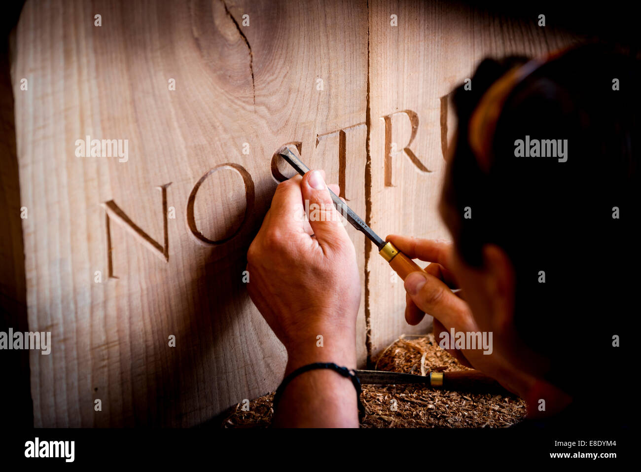 Keith Pettit working on his Elm sculpture in the village of Lullington ...