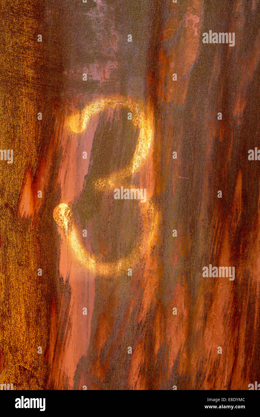 Number three spray painted on a rusty old door Stock Photo - Alamy
