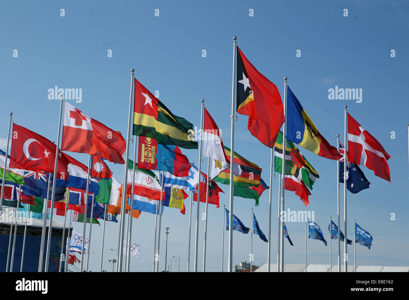 Many Flags blowing in the wind Stock Photo - Alamy