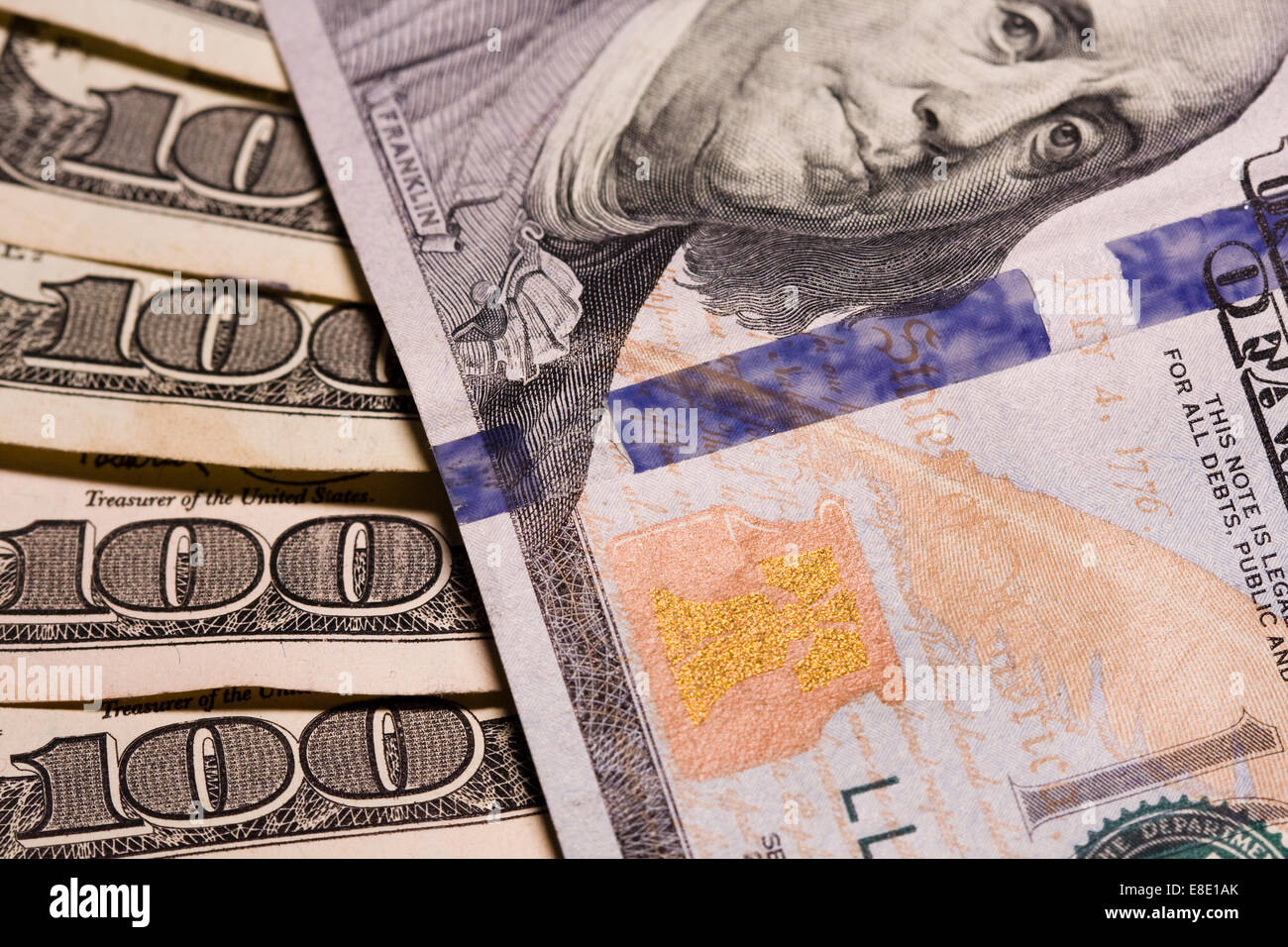 Many Hundred Dollar bills showing micro printing, color reflective gold ...