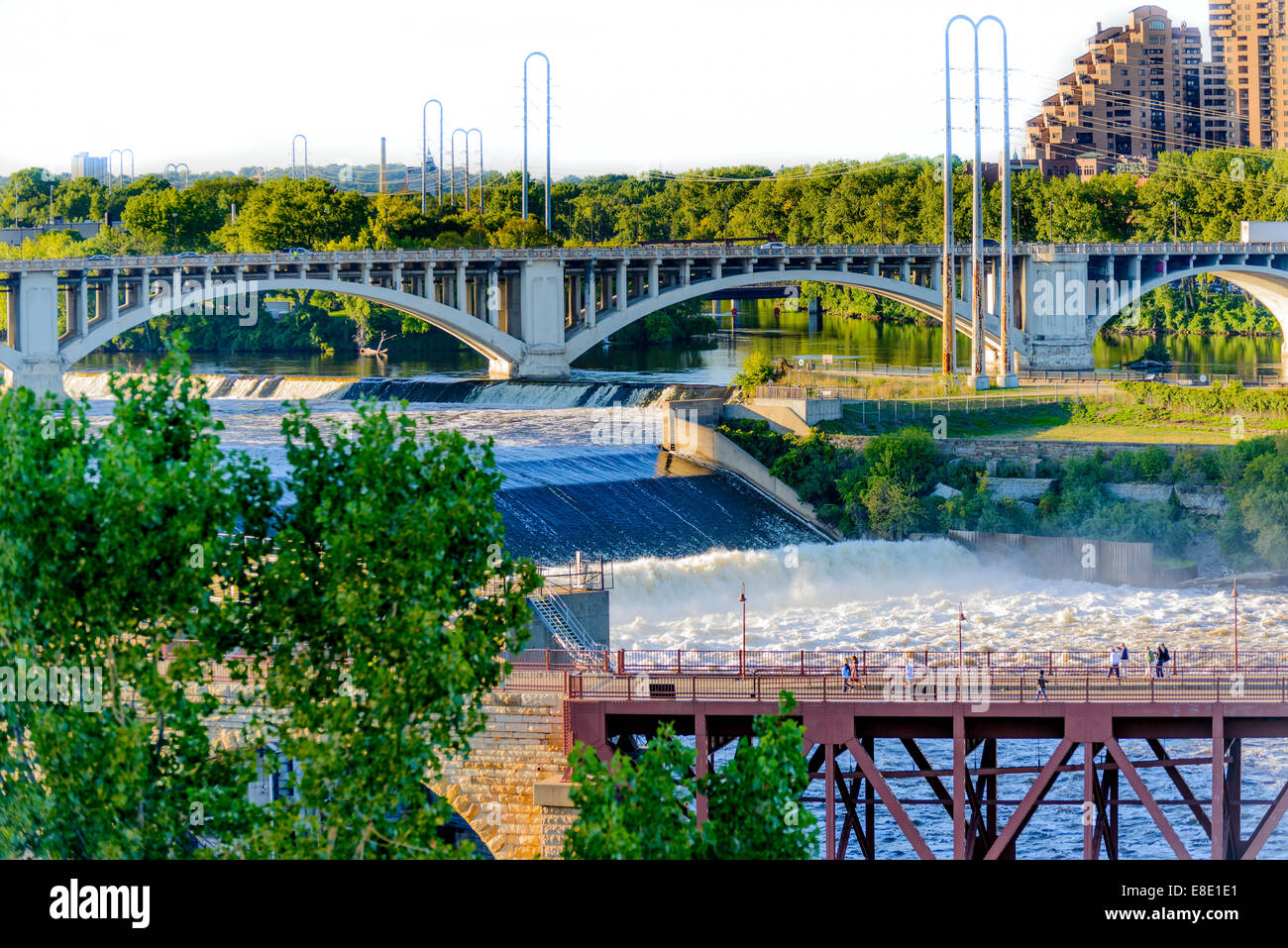 Minneapolis, MN, river and bridge with runners near downtown Stock ...