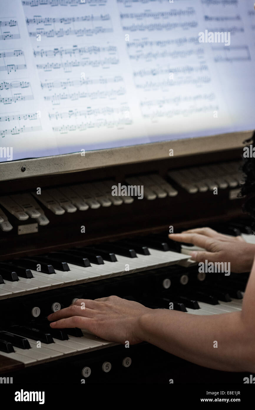 Hands of Someone playing Organ In a Church Stock Photo - Alamy