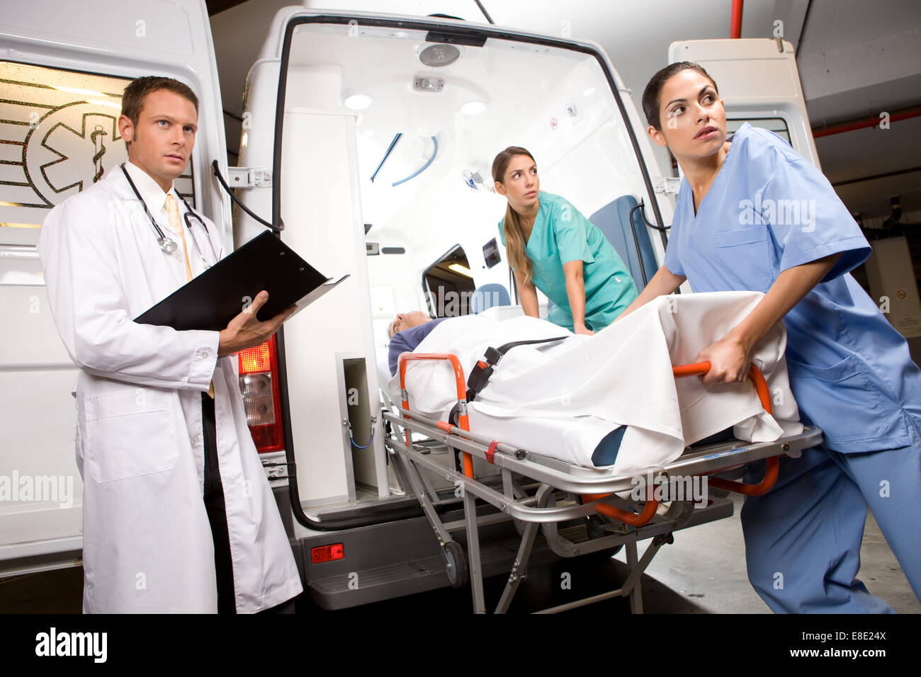 Paramedics with a stretcher Stock Photo - Alamy