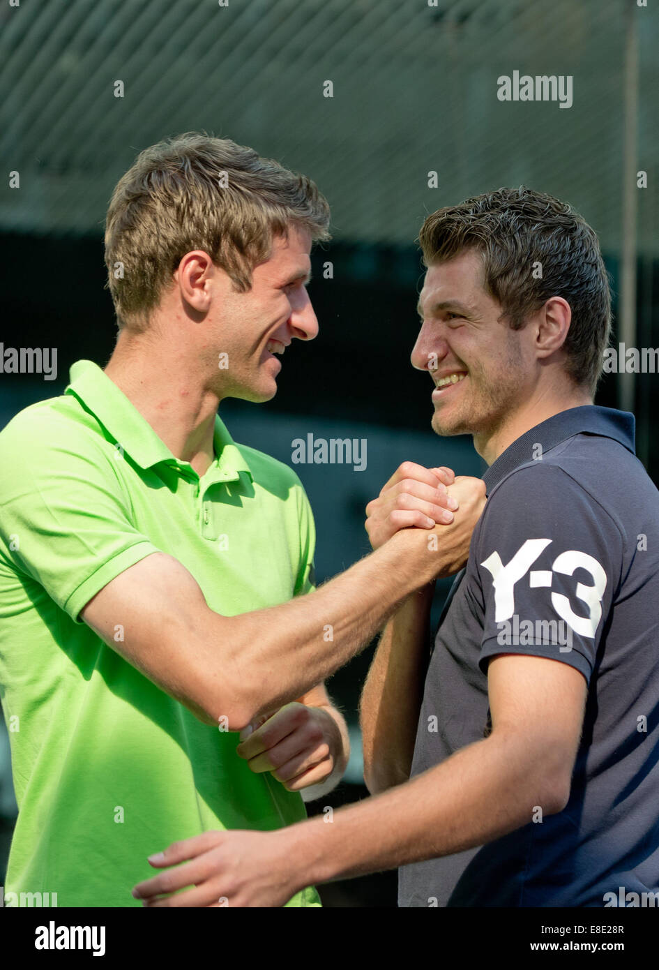German national team soccer player Thomas Mueller (L) shakes hands with ...