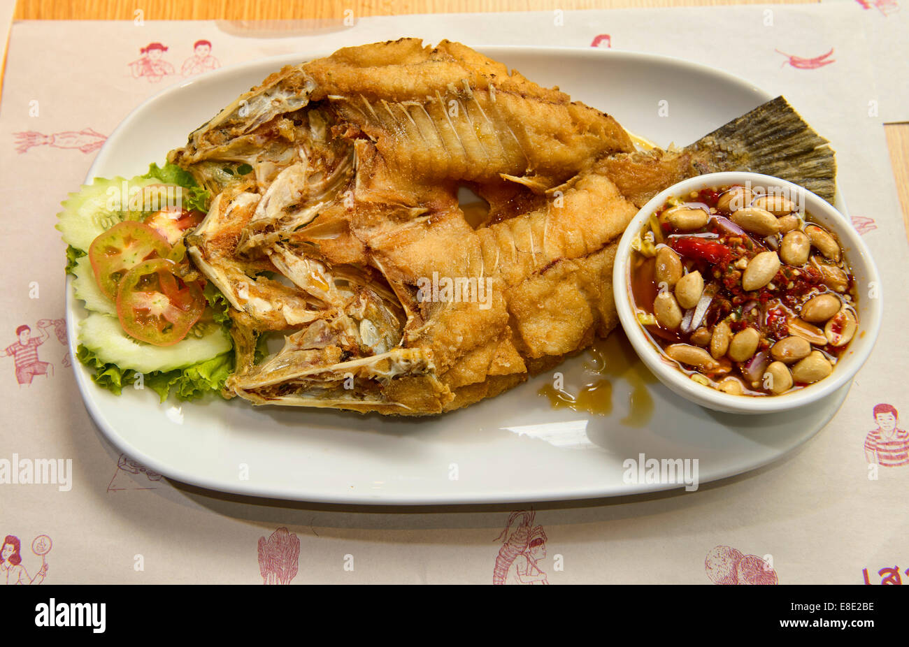 delicious fried fish and mango peanut sauce at a restaurant in Bangkok ...