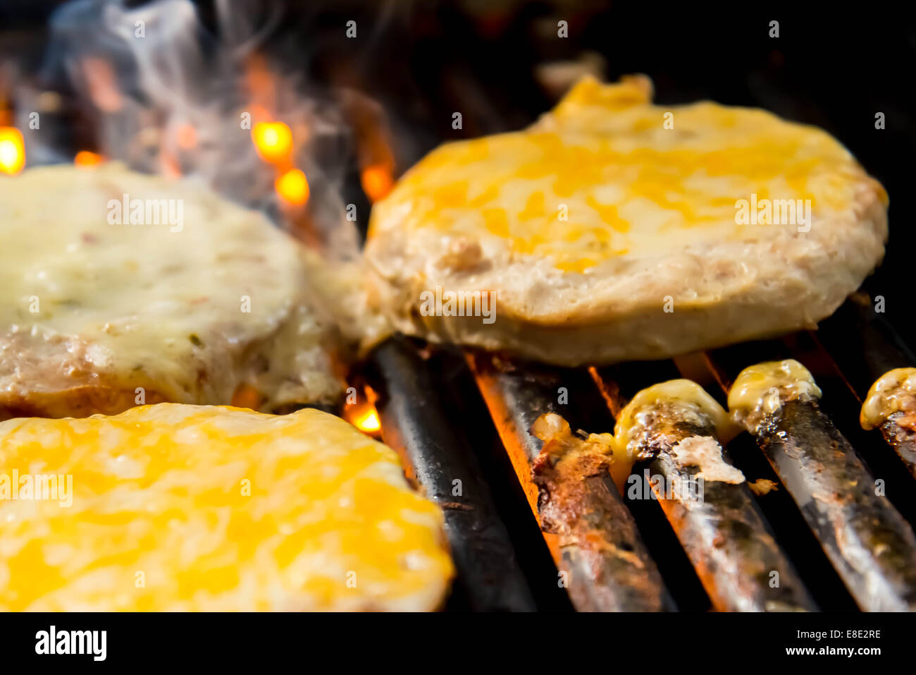 cheeseburgers on the grill, BBQ Stock Photo - Alamy
