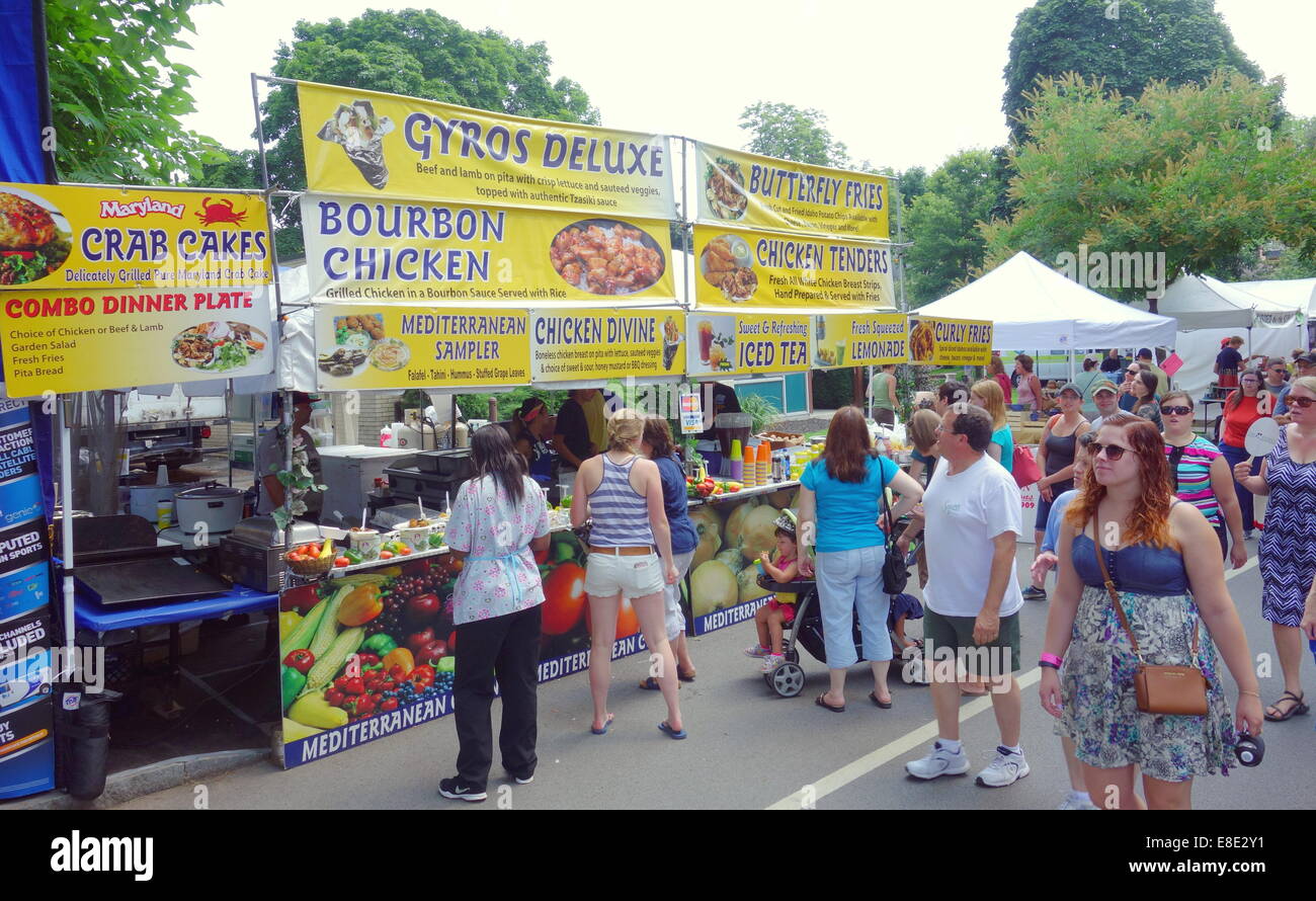 People walking and food stands at a street festival in Rochester, New ...