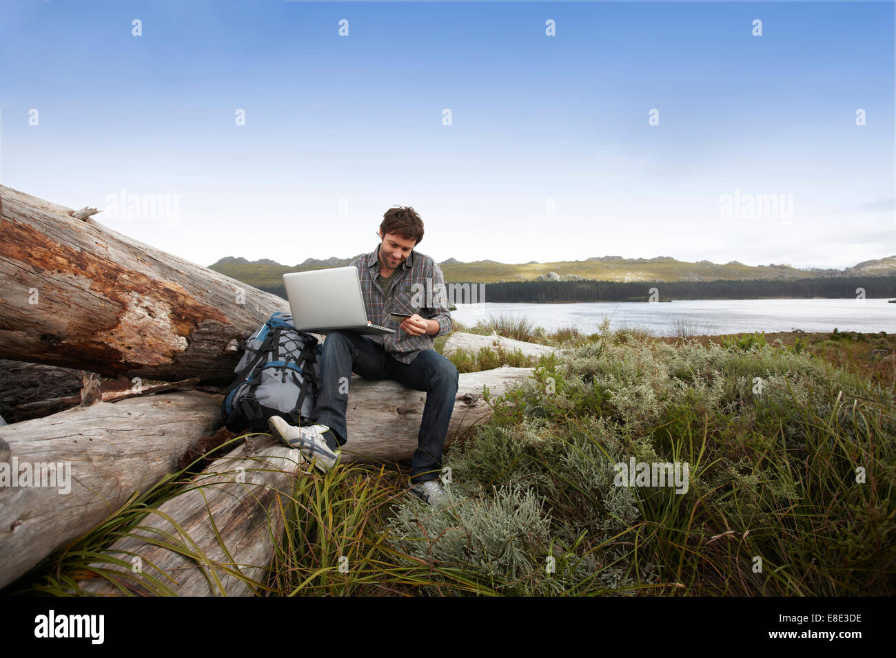 Tourist paying online Stock Photo - Alamy