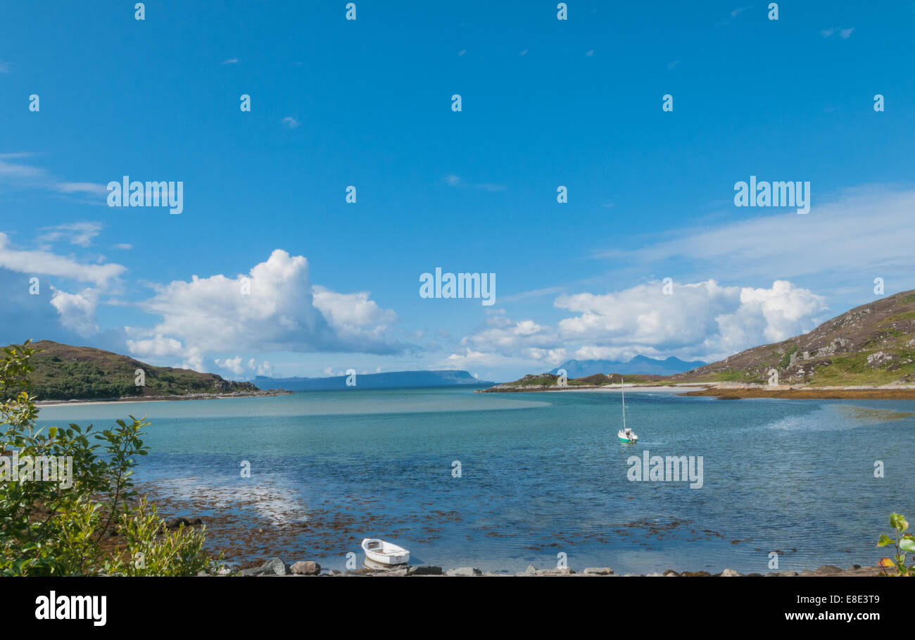 Looking over River Morar to Morar sands with yacht at anchor with Isle ...