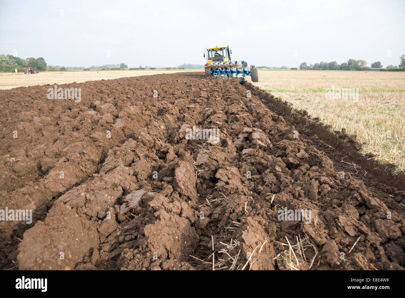 A man ploughing using a tractor in a ploughing match at Cottenham ...