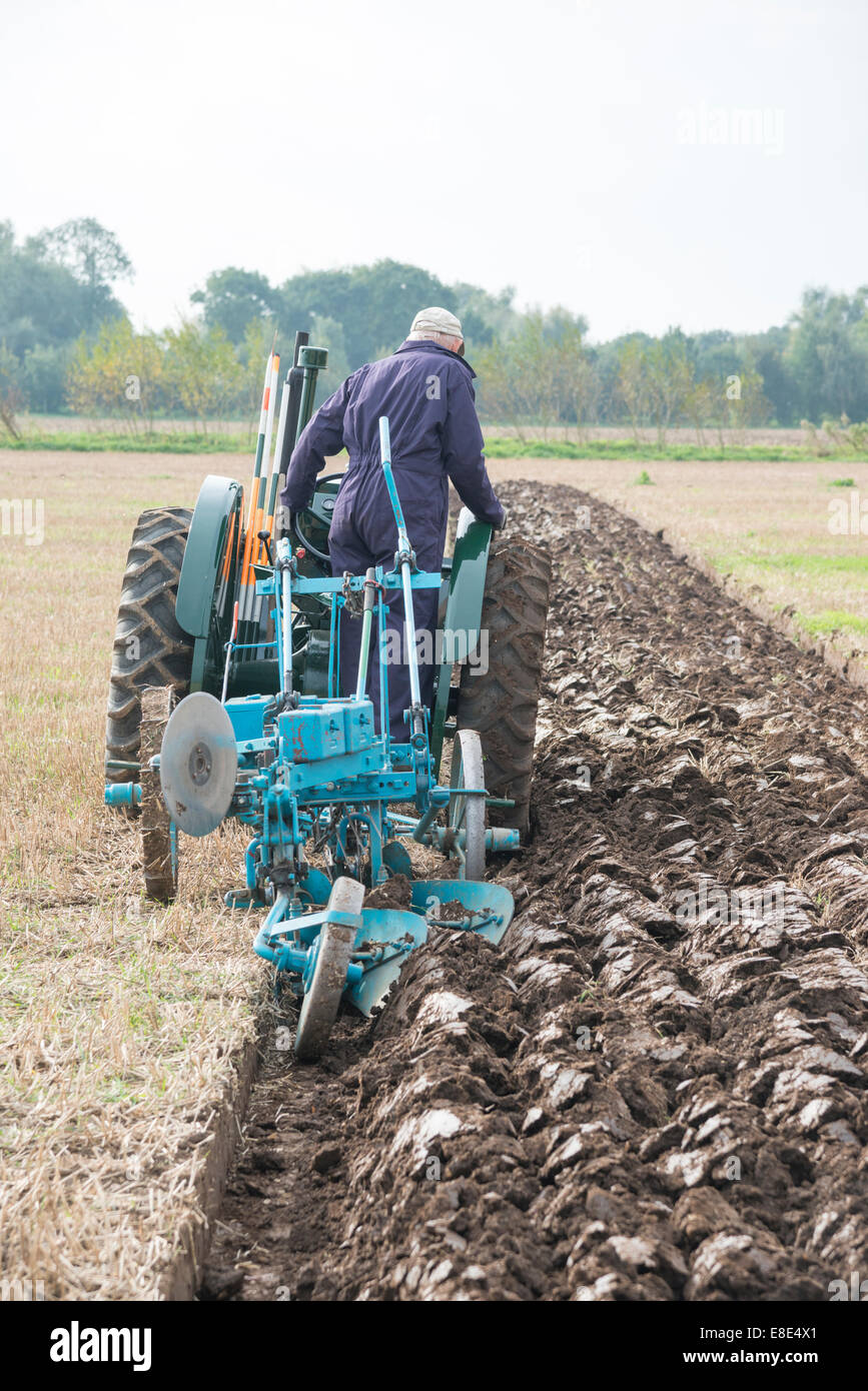 A man ploughing using a tractor in a ploughing match at Cottenham ...
