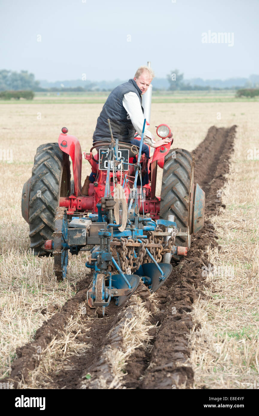 A man ploughing using a tractor in a ploughing match at Cottenham ...