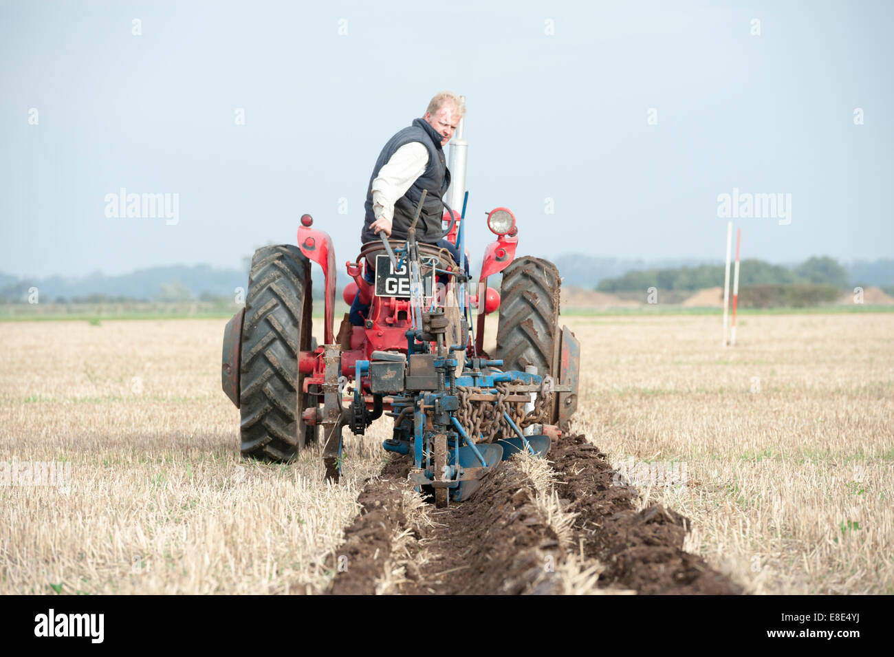 A man ploughing using a tractor in a ploughing match at Cottenham ...