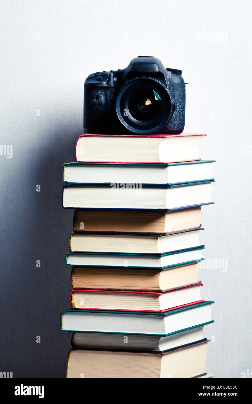 Picture Camera on a high stack of books Stock Photo - Alamy