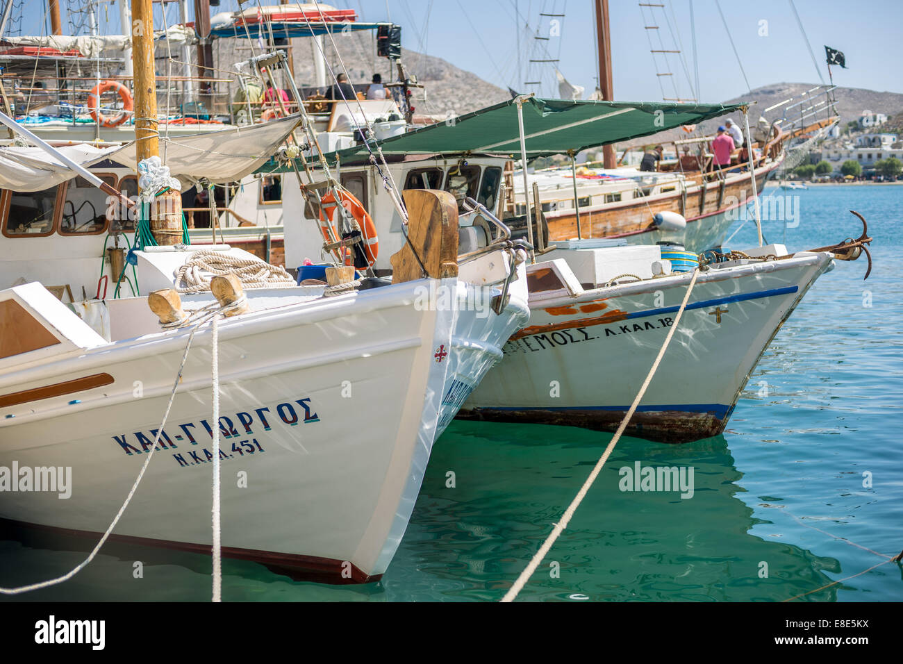 Old colorful wooden greek fishing boats Nisiros Dodecanese Stock Photo ...