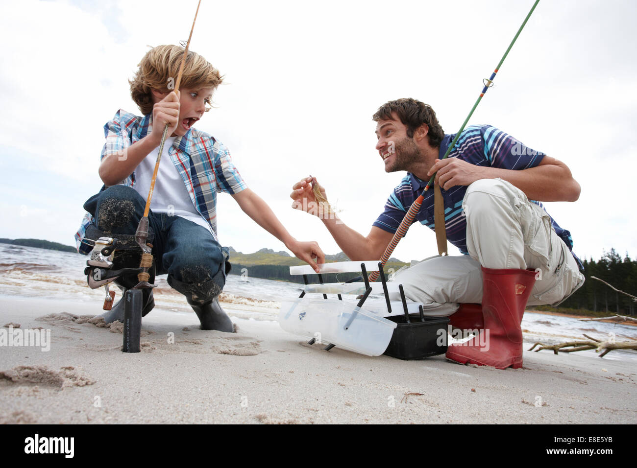 Boy scared of a fake fish Stock Photo - Alamy