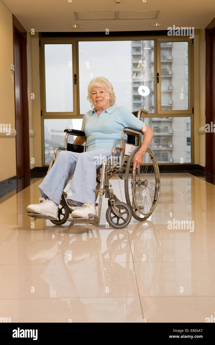 Elderly woman in a wheelchair Stock Photo - Alamy