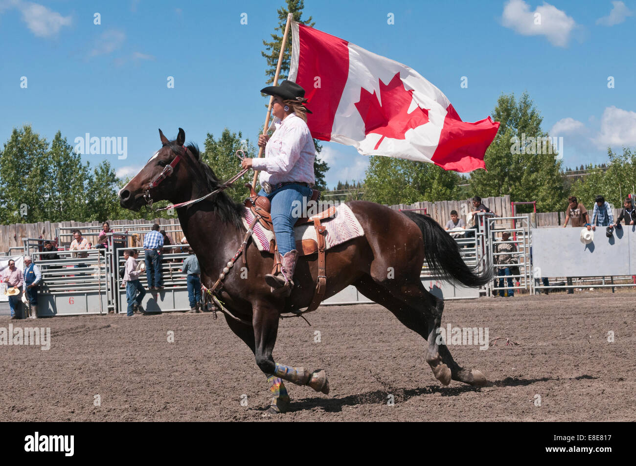 Canadian flag, maple leaf, being carried by rider, T'suu Tina Rodeo ...