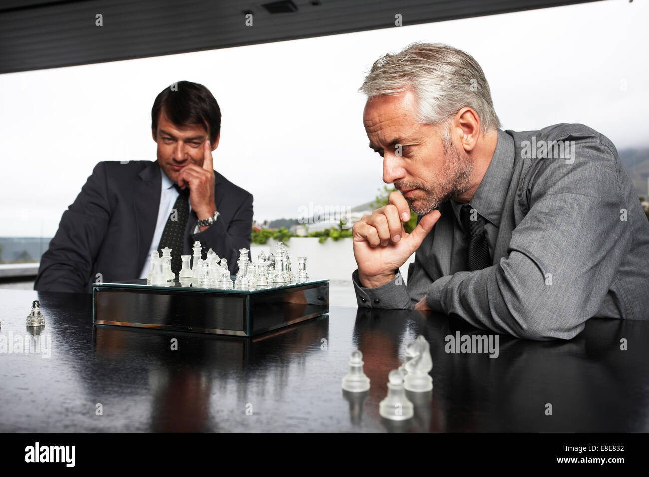Men playing chess Stock Photo - Alamy