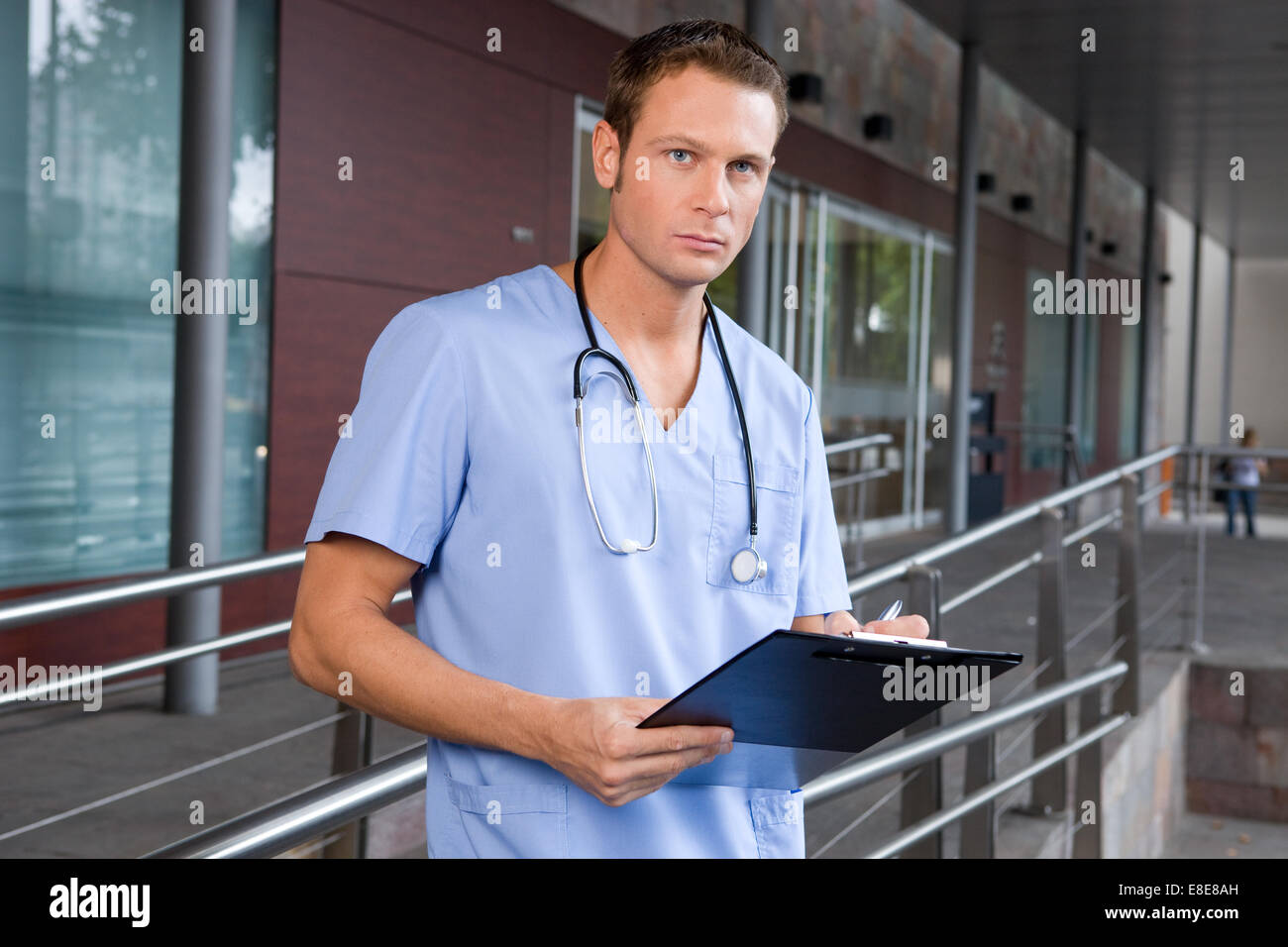 Doctor outside hospital Stock Photo - Alamy