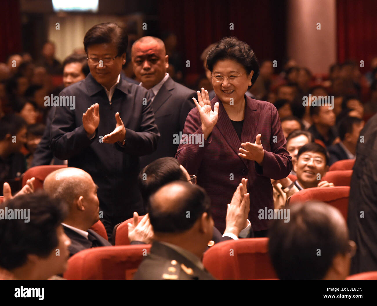 Urumchi, China. 6th October, 2014. Chinese Vice Premier Liu Yandong (R, front) greets audiences ...