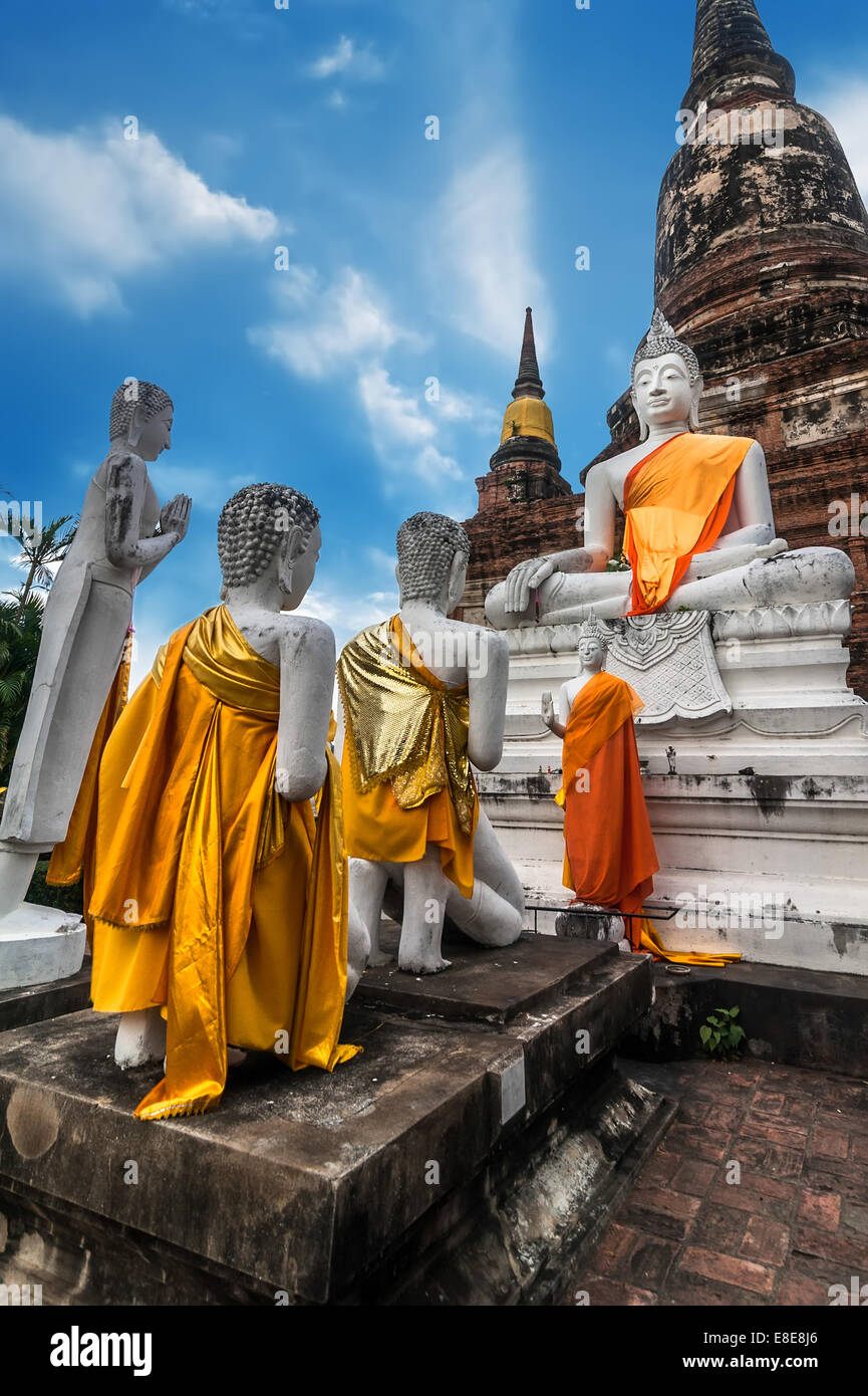 Asian religious architecture. Ancient sandstone sculpture of praying ...
